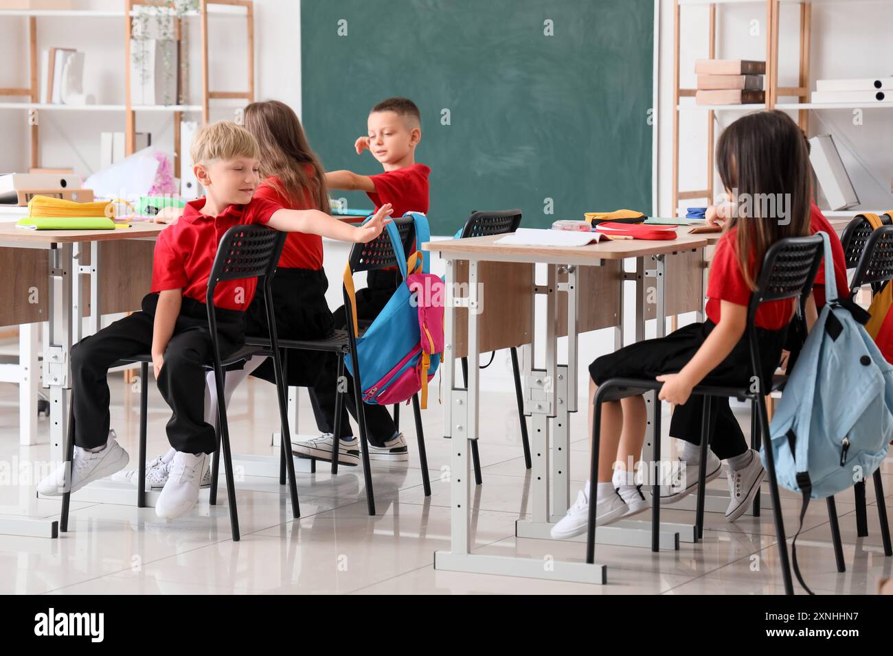 Little school children in classroom during lesson Stock Photo - Alamy