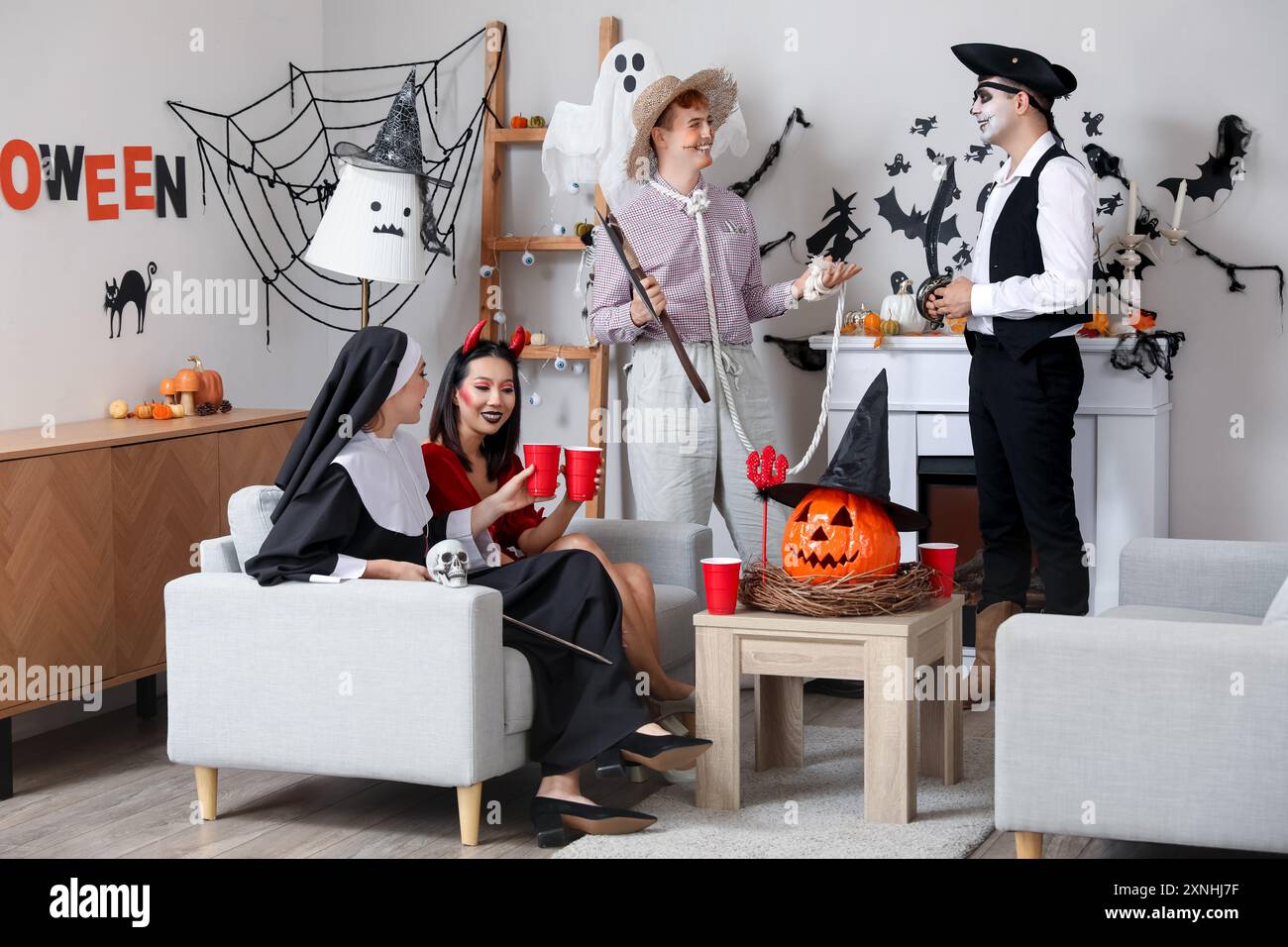 Women in halloween costumes drinking hi-res stock photography and ...