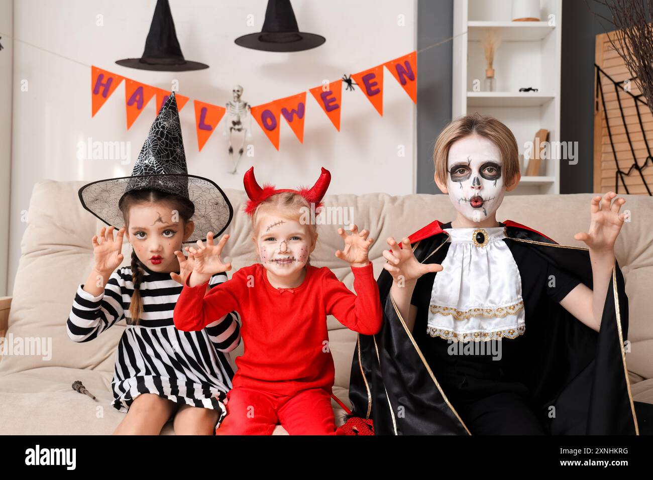 Little children celebrating Halloween at home Stock Photo - Alamy