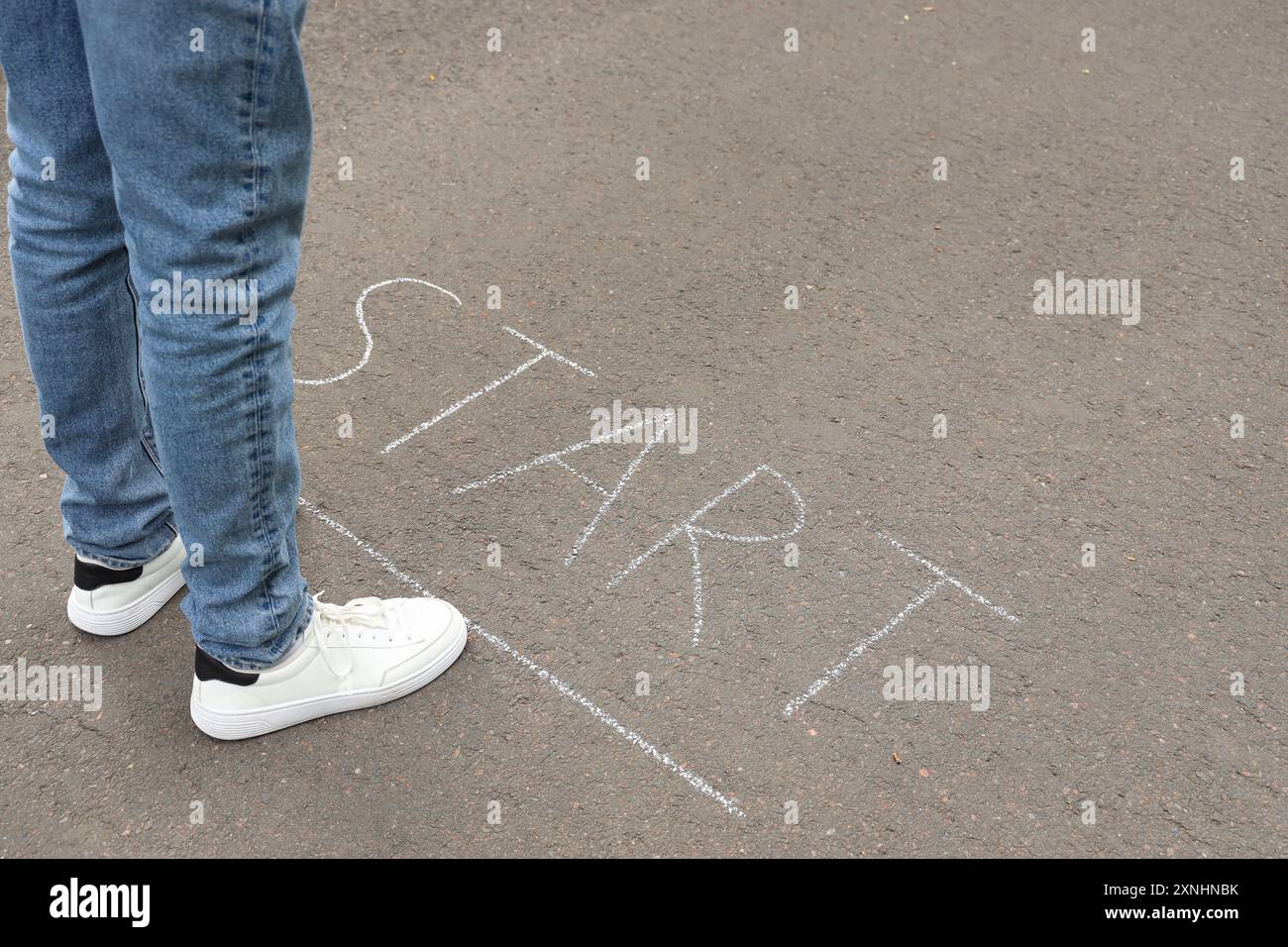 Man standing on road with word START. Concept of new beginning Stock ...
