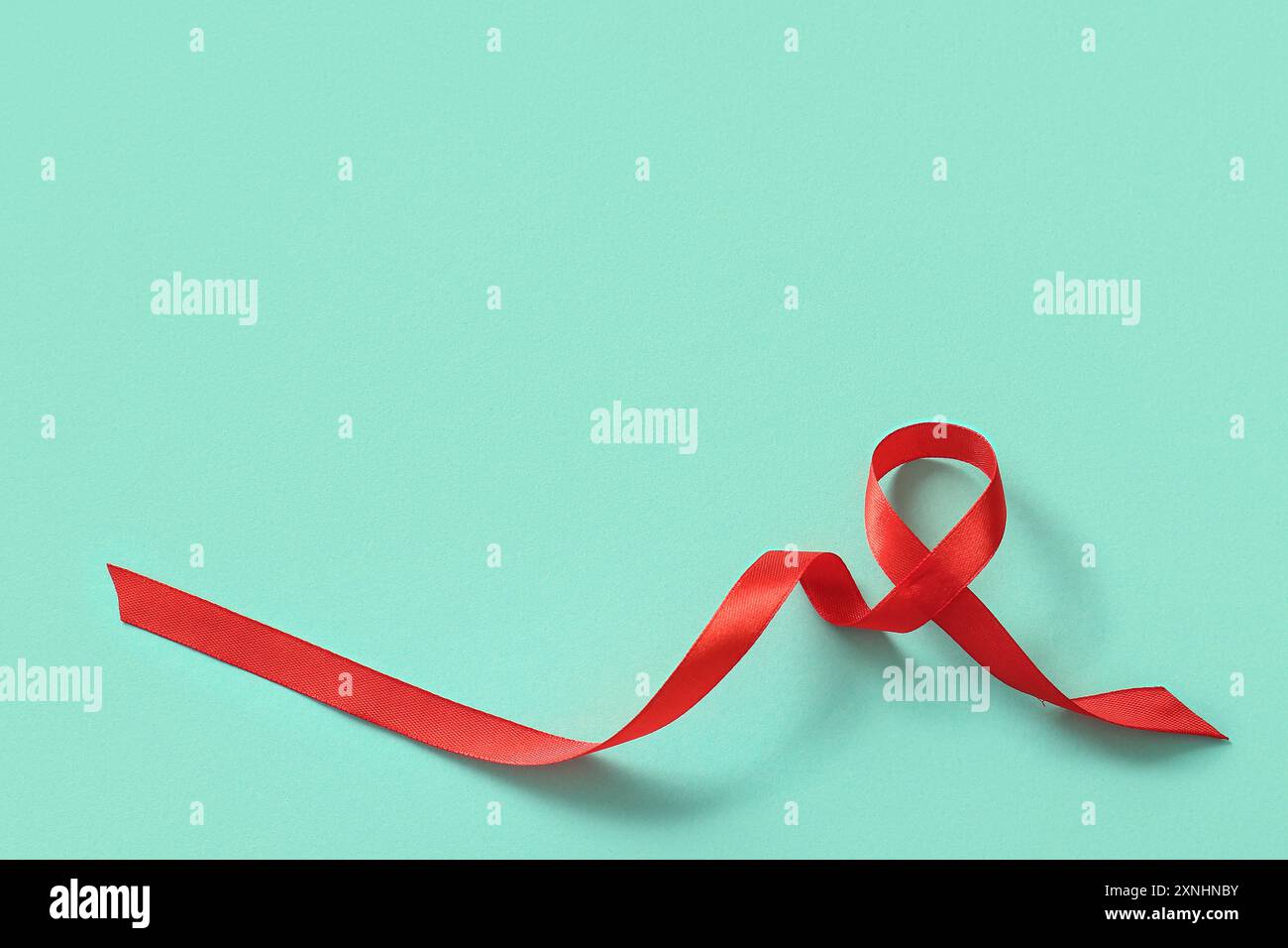 Red ribbon on turquoise background. Blood Cancer Awareness Month Stock ...