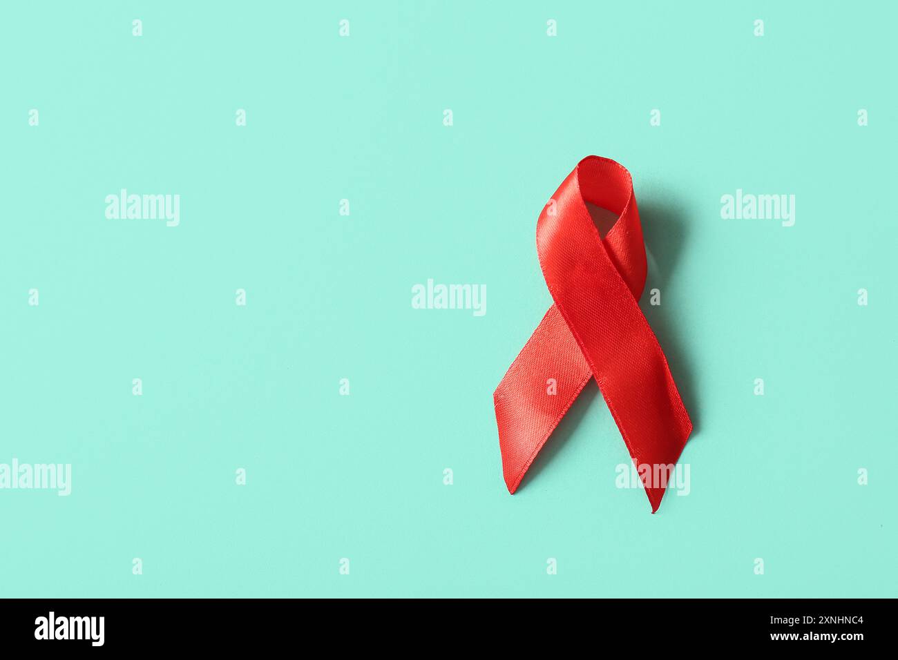 Red ribbon on turquoise background. Blood Cancer Awareness Month Stock ...