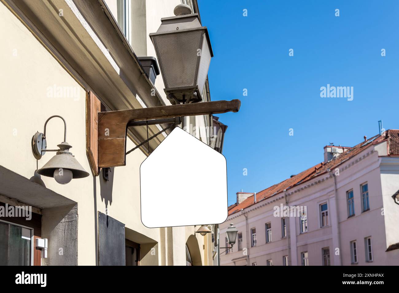 Mockup Of Store Signboard Hanging On A Yellow Wall. House Shaped Shop ...