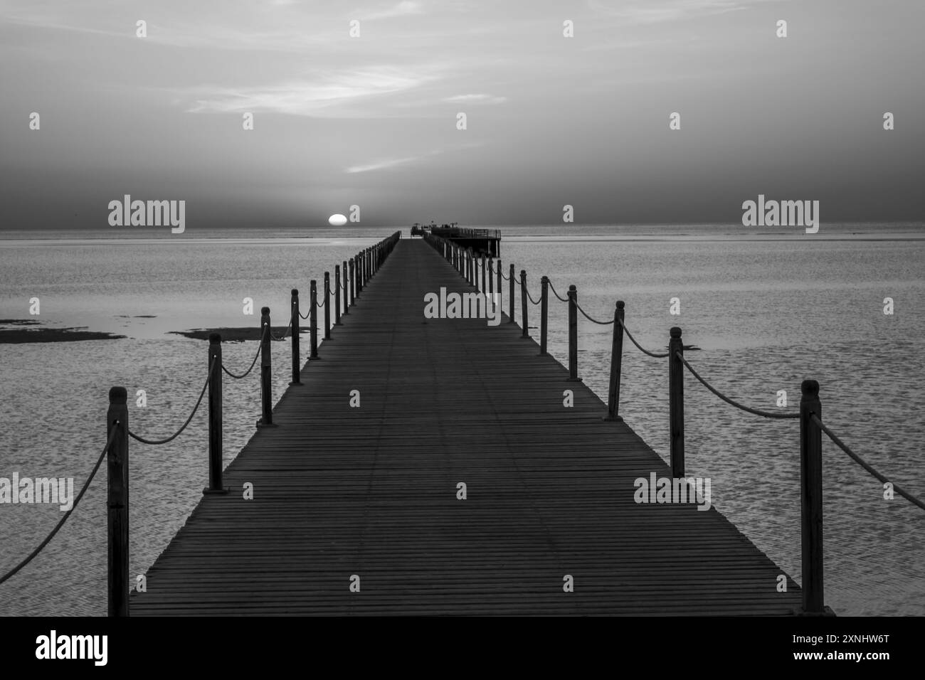 Black and white photography Long jetty at sunrise on the Red Sea in ...