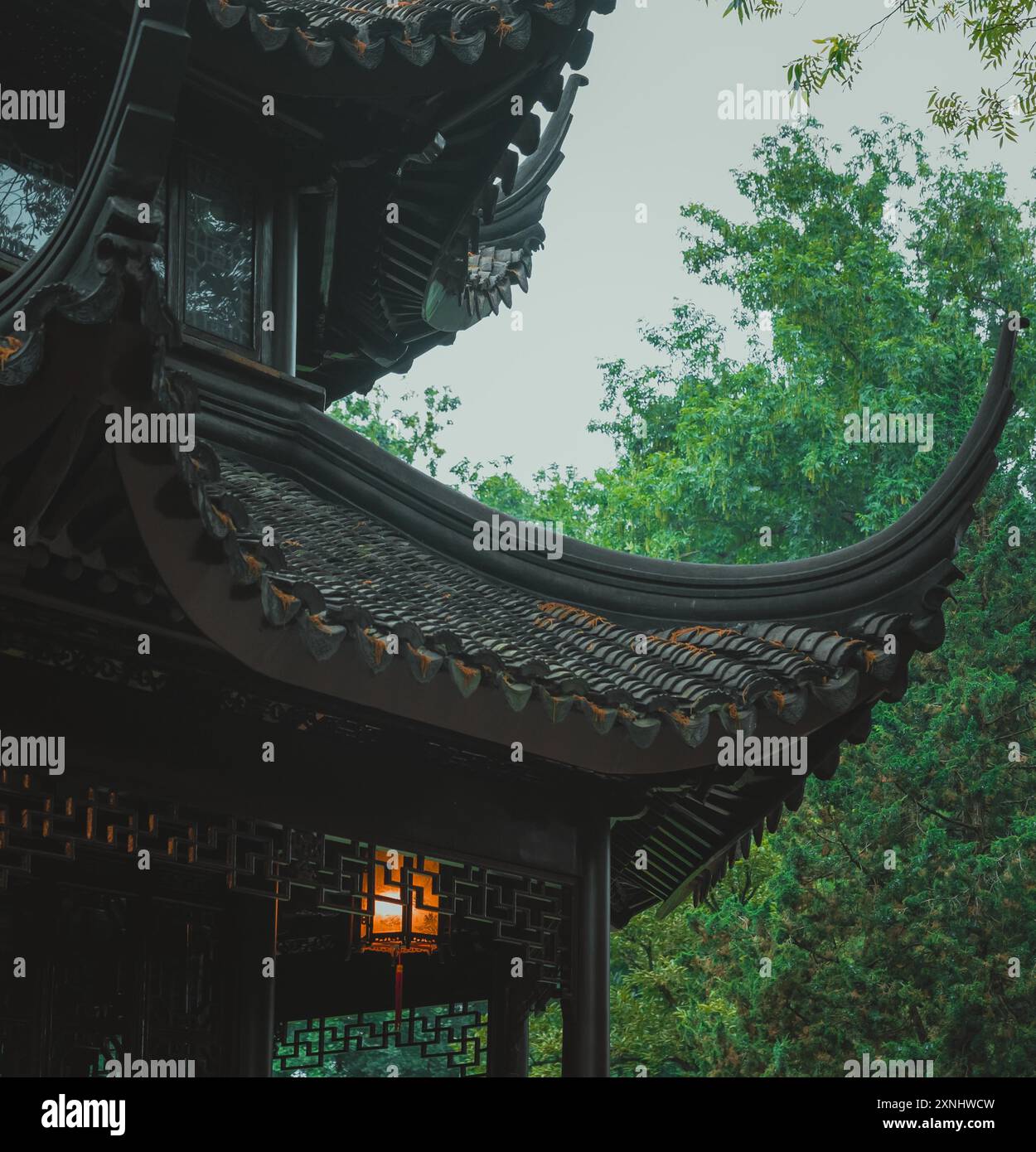 A low angle view of a traditional Chinese garden pavilion with a curved ...