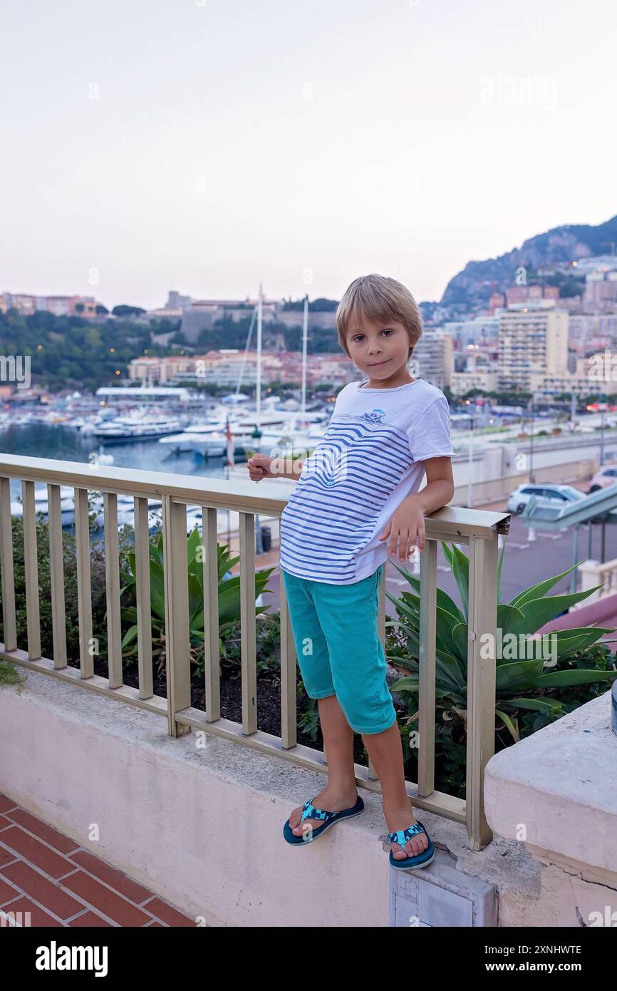 Happy child, visiting Monaco during summer, enjoying sunny days in ...