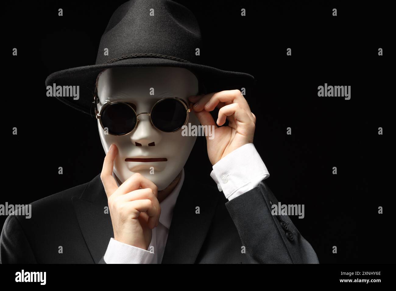 Theatrical performance. Man with plastic mask and sunglasses on black ...