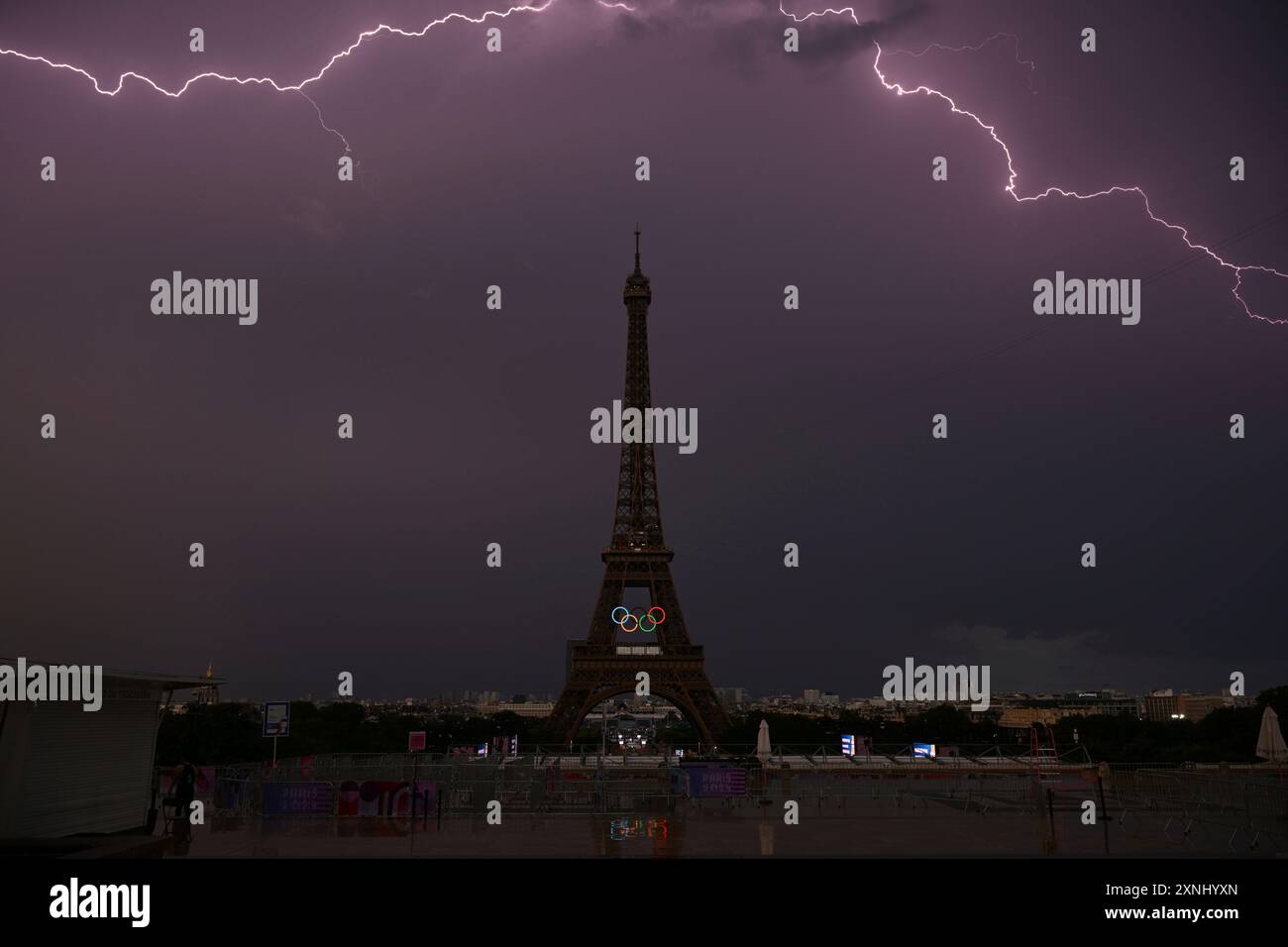 A lightning strikes above the Eiffel Tower in Paris on July 31, 2024 ...
