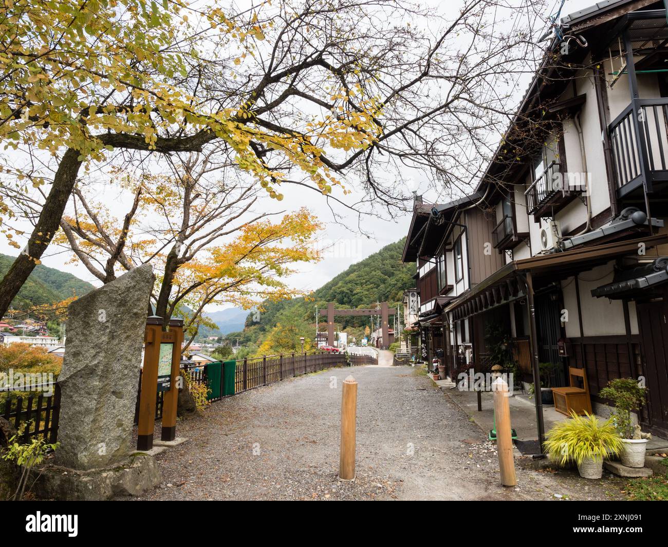 Kiso, Nagano prefecture, Japan - October 23, 2017: Traditional Japanese houses and fall foliage ...