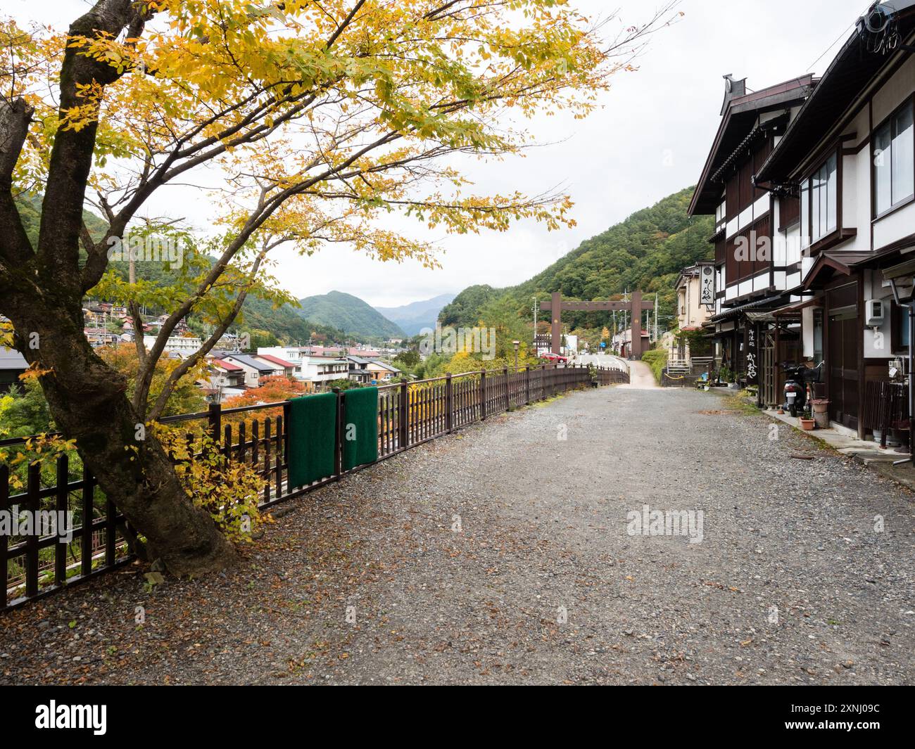 Kiso, Nagano prefecture, Japan - October 23, 2017: Traditional Japanese houses and fall foliage ...