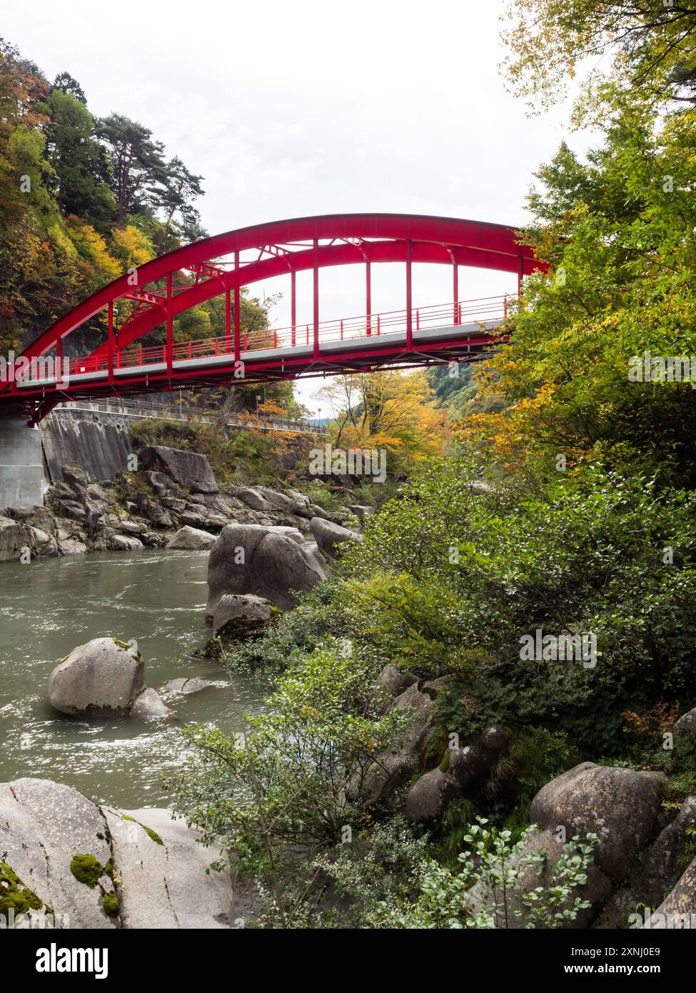 Red bridge over the Kiso river at Kiso-no-Kakehashi, a scenic spot in ...