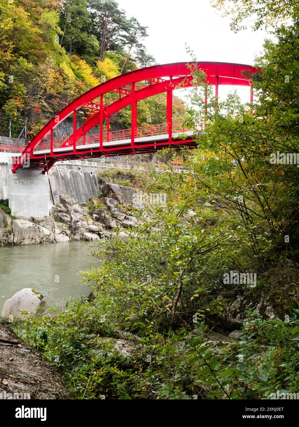 Red bridge over the Kiso river at Kiso-no-Kakehashi, a scenic spot in ...