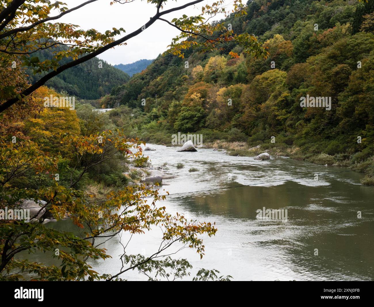 Scenic Kiso river valley in early fall with leaves starting to change ...