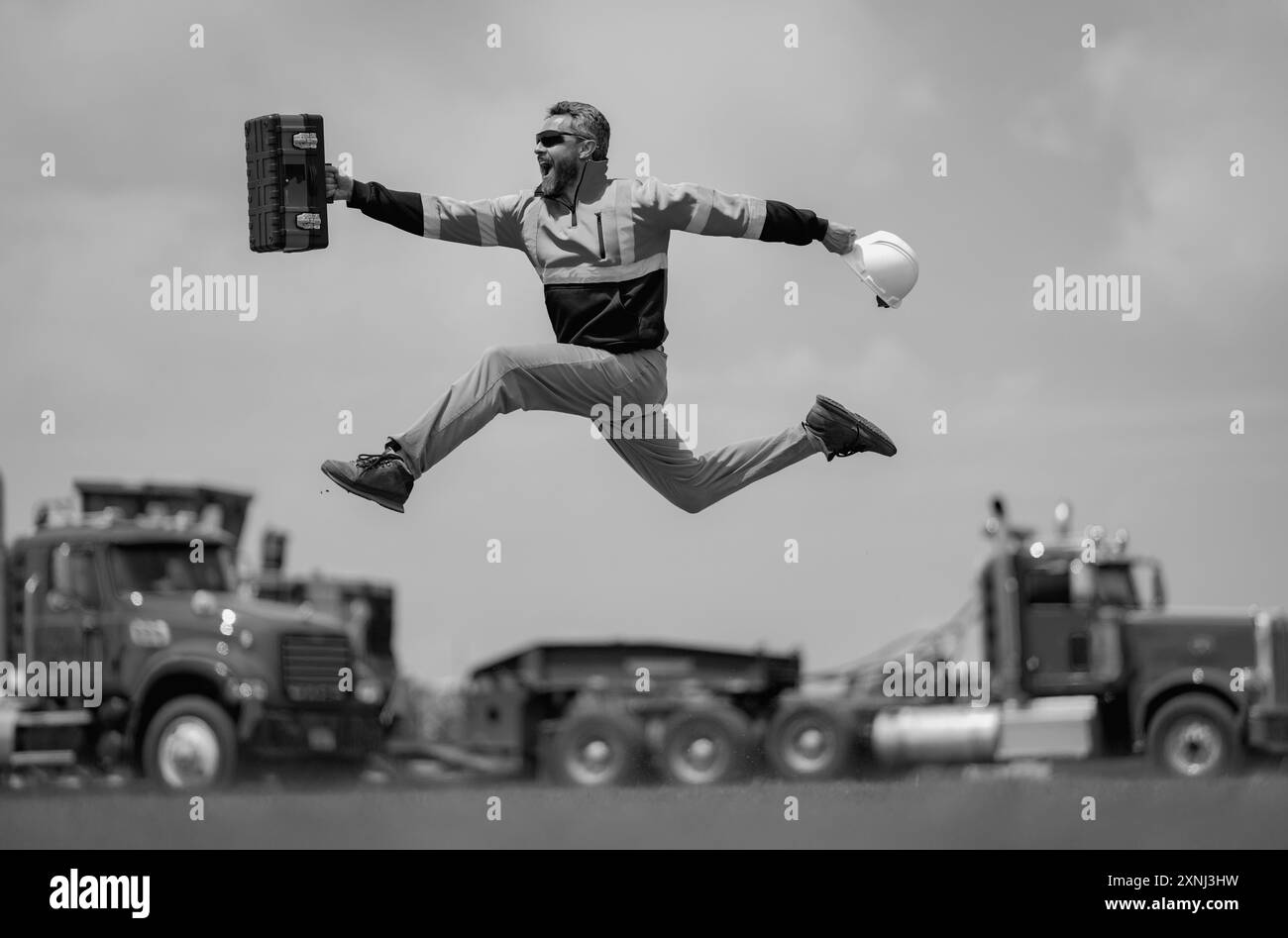 Hispanic builder excited jump and run on site construction. Excited ...