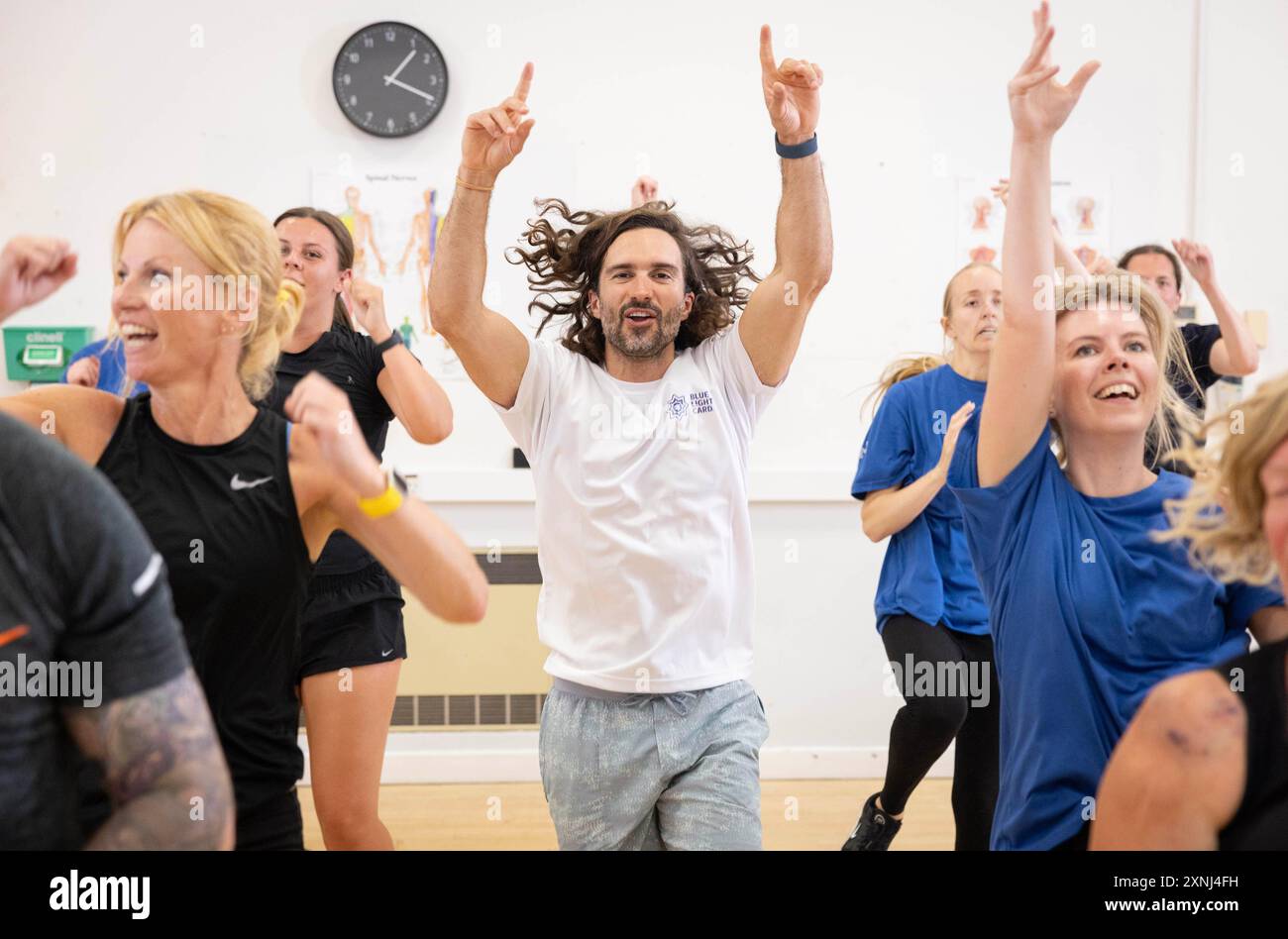 EDITORIAL USE ONLY Joe Wicks leads an exercise class at Royal Surrey ...