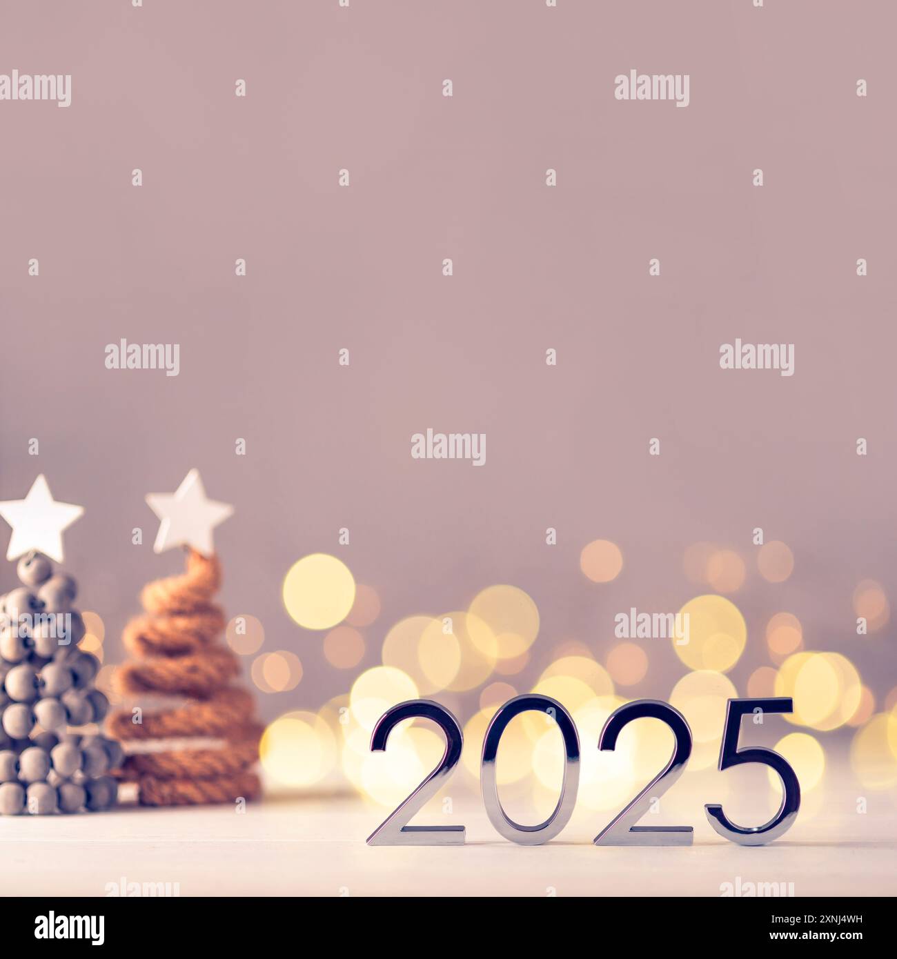 Metal numbers 2025 on table with bokeh lights Stock Photo - Alamy