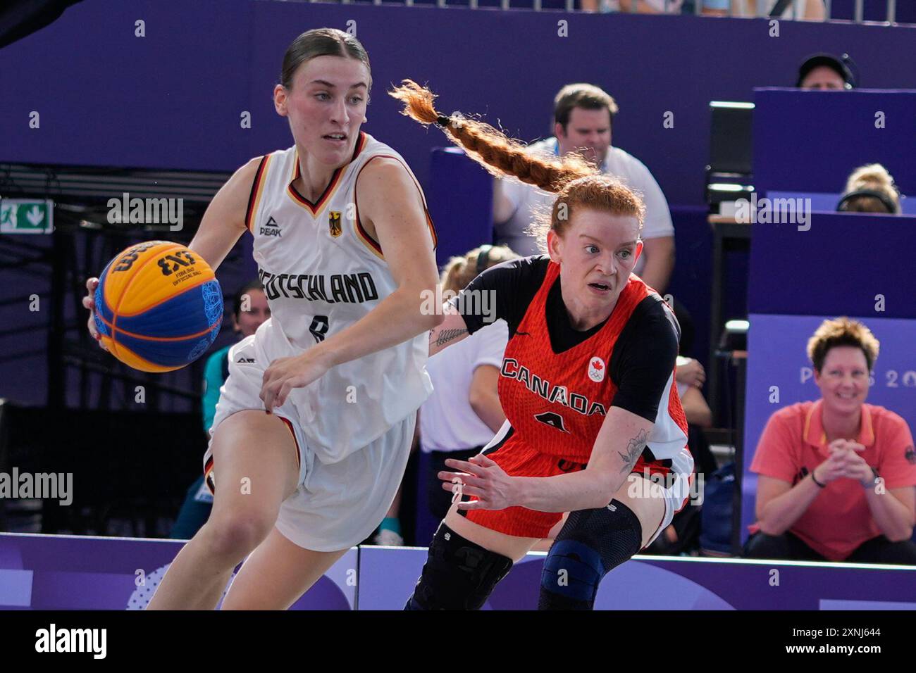 Germany's Elisa Mevius (8) drives past Canada's Kacie Bosch (4) in the ...