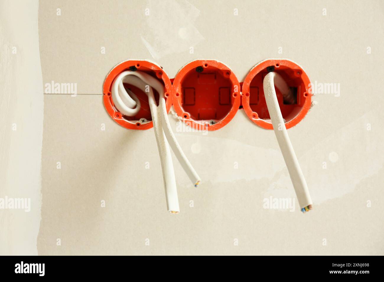 Holes for socket in wall with cables indoors. Installation of ...