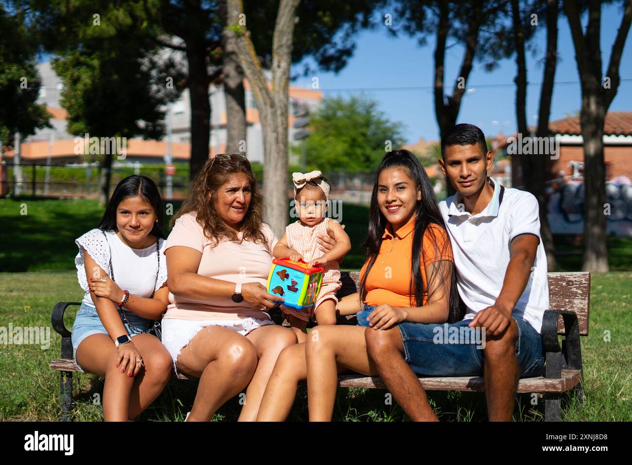 Portrait of Peruvian family of young father, mother, aunt, grandmother ...