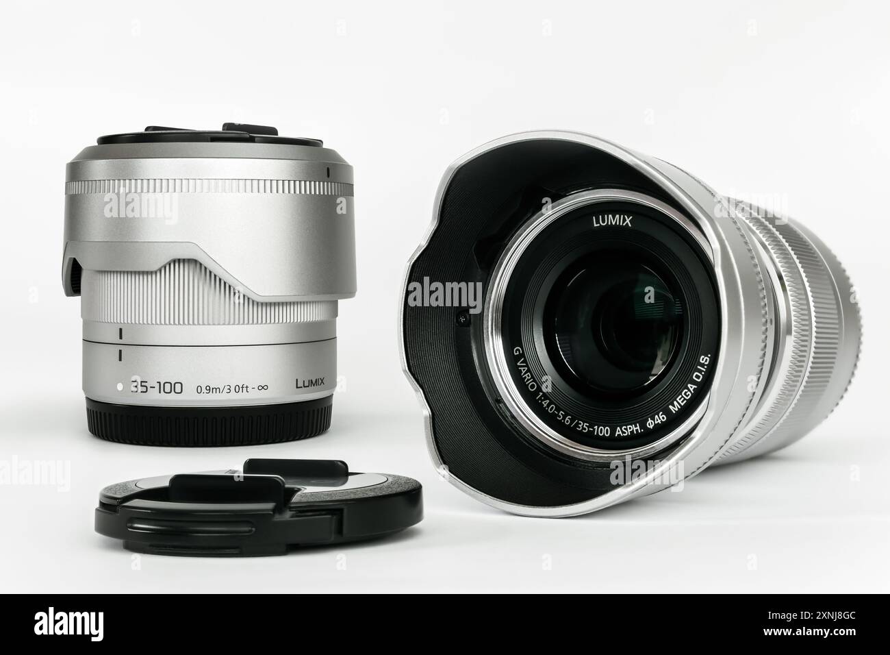 Panasonic Micro 4/3 Lens 35-100mm F4-5.6 Silver with lens hood in horizontal and vertical ...