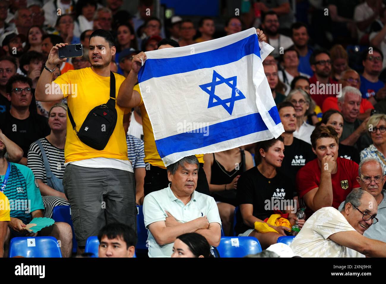 Spectators with an Israel flag at the Champ-de-Mars Arena on the sixth ...