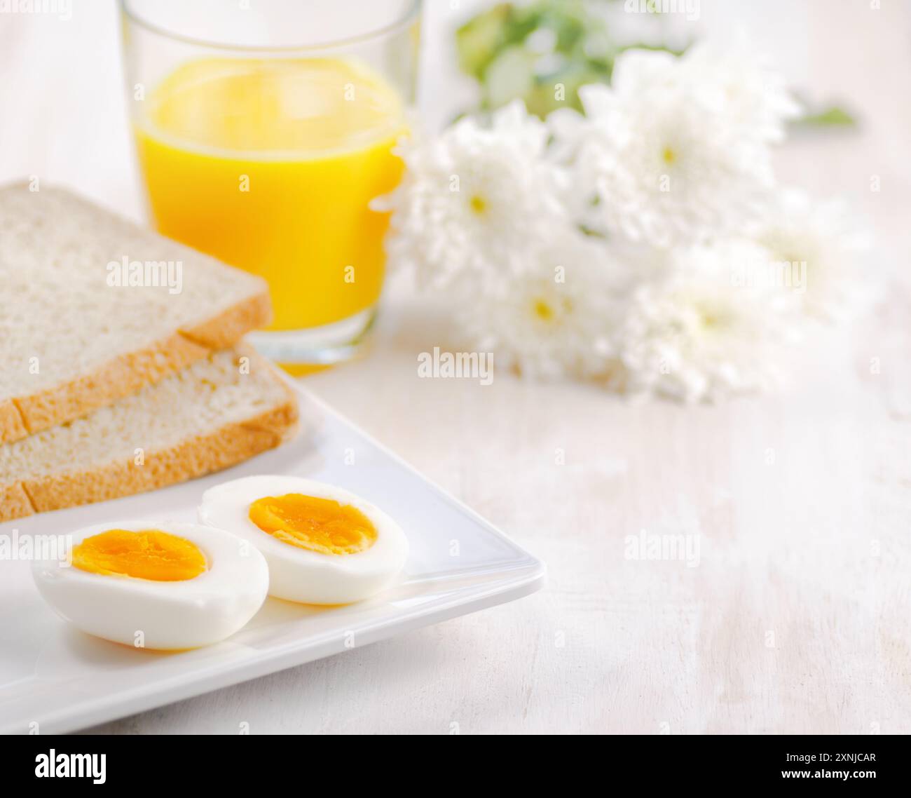 Boiled egg, toasts and orange juice Stock Photo - Alamy