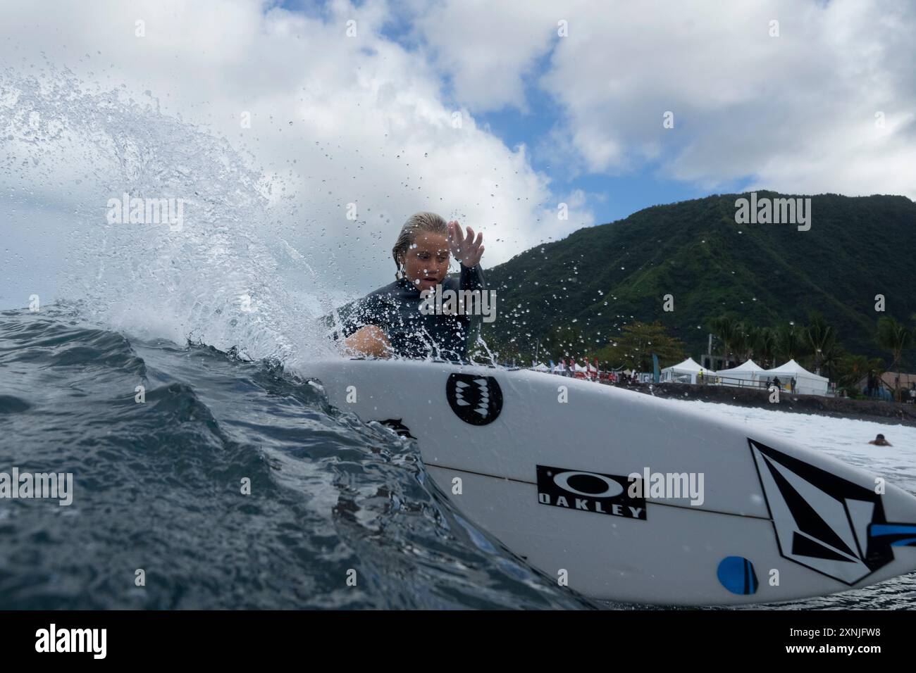 Kelia Gallina, 11, surfs her home shore break during a break in the ...