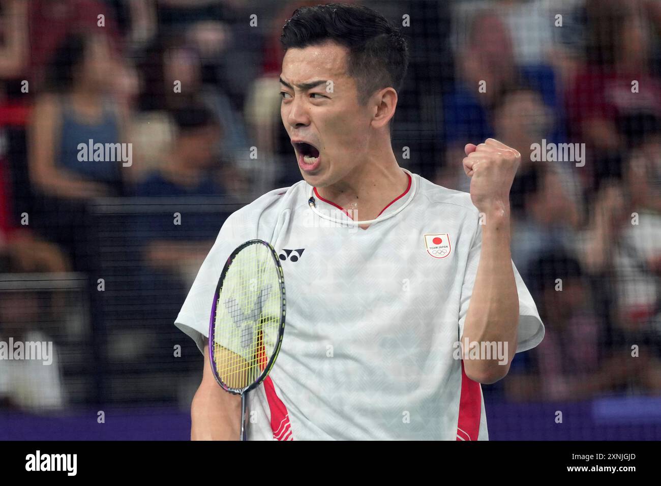 Japan's Kenta Nishimoto reacts as he plays against Thailand's Kunlavut ...