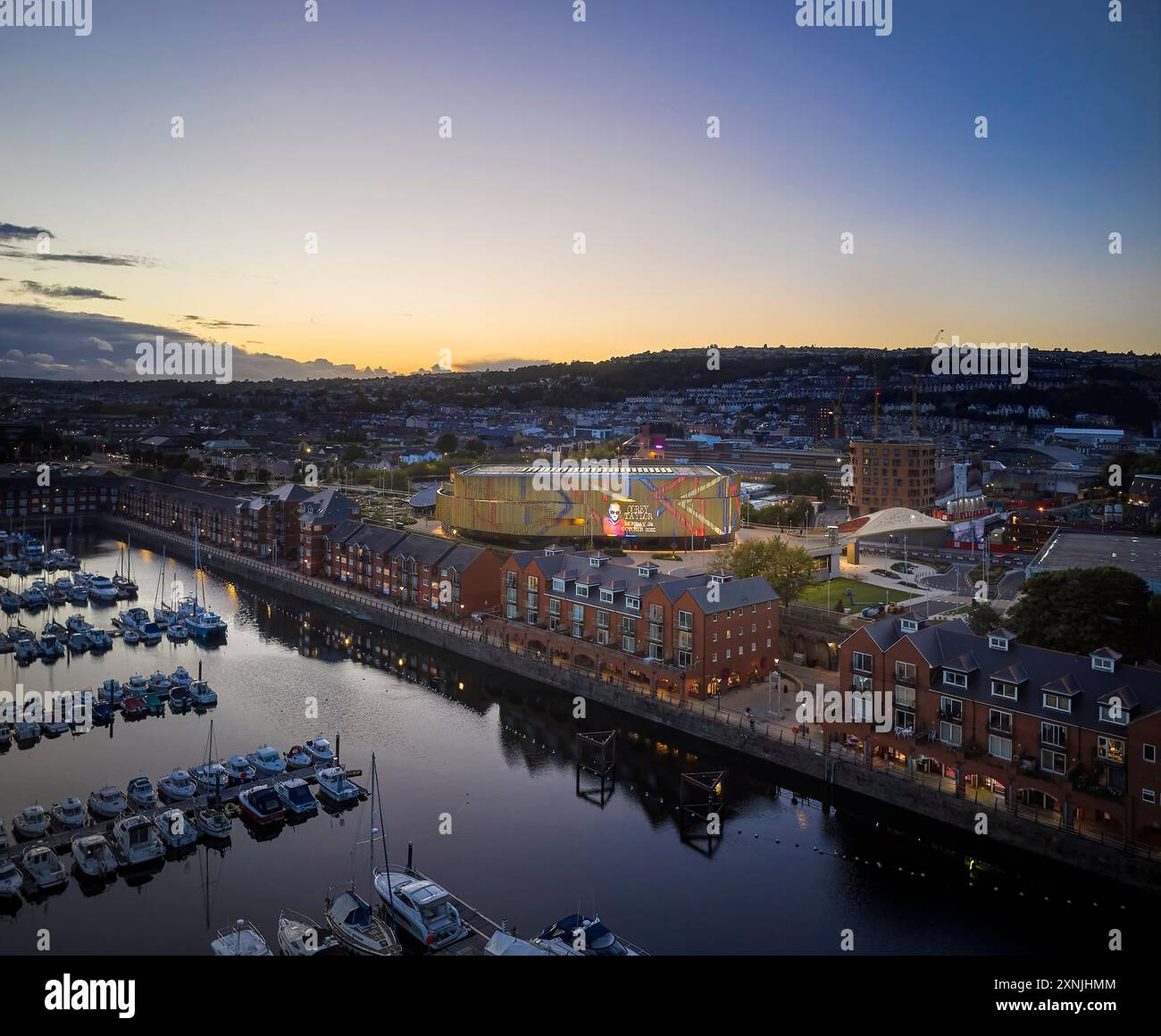 Aerial view of marina and arena at dusk. Swansea Arena and Copr Bay ...