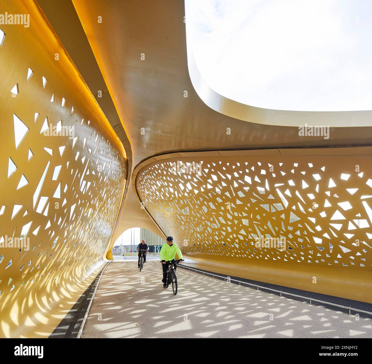 Perforated canopy of bicycle and pedestrian bridge. Swansea Arena and ...