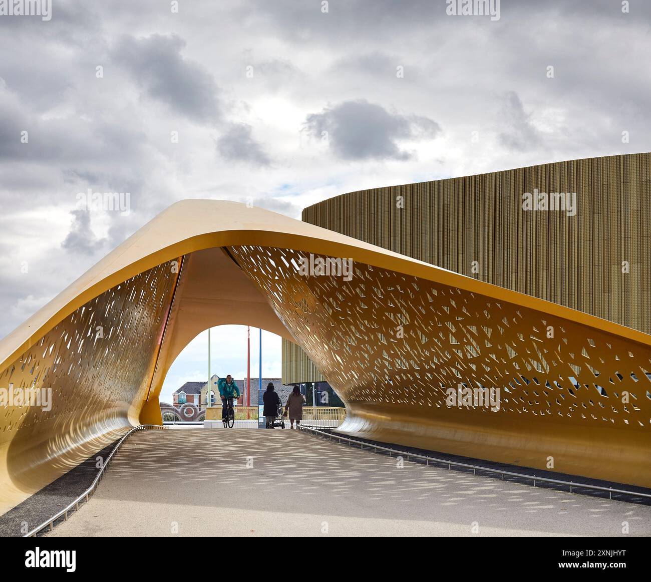Perforated canopy of bicycle and pedestrian bridge. Swansea Arena and ...