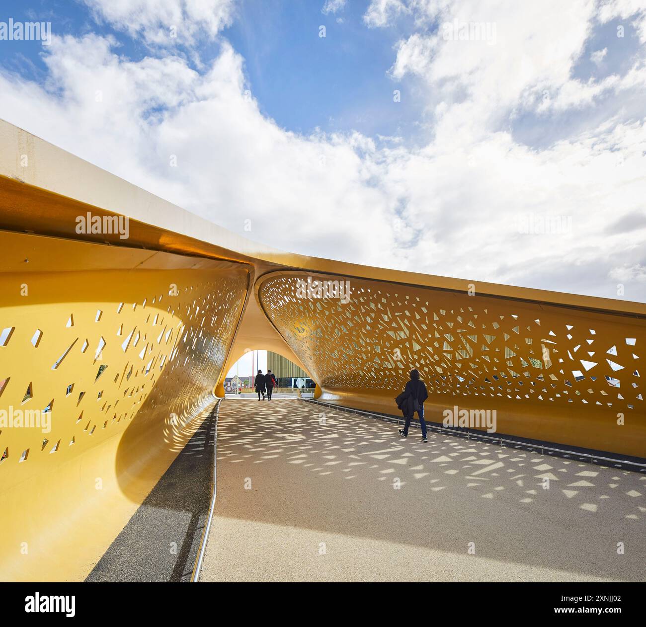 Perforated canopy of bicycle and pedestrian bridge. Swansea Arena and ...