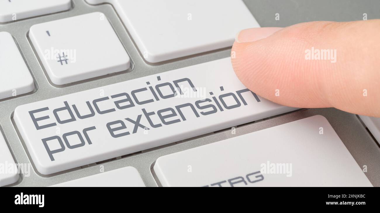 A keyboard with a labeled button - Further education in spanish Stock ...