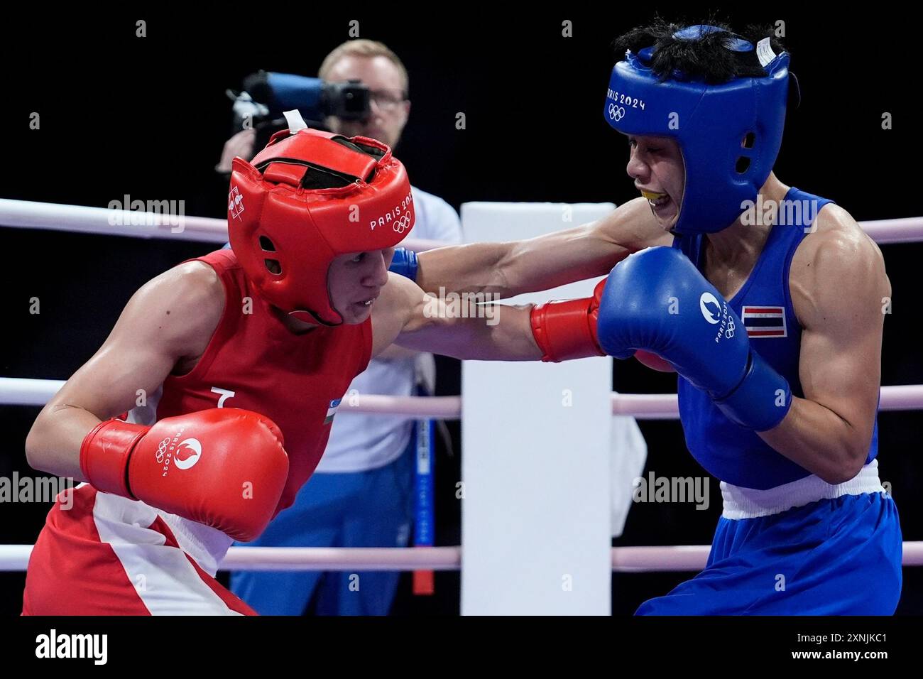 Uzbekistan's Sabina Bobokulova, left, fights Thailand's Chuthamat Raksat in their women's 50kg ...