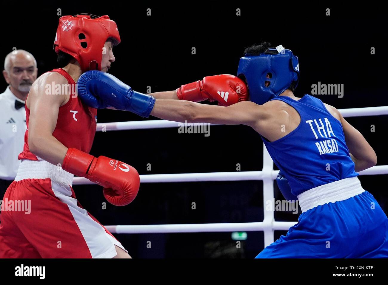 Uzbekistan's Sabina Bobokulova, left, fights Thailand's Chuthamat ...