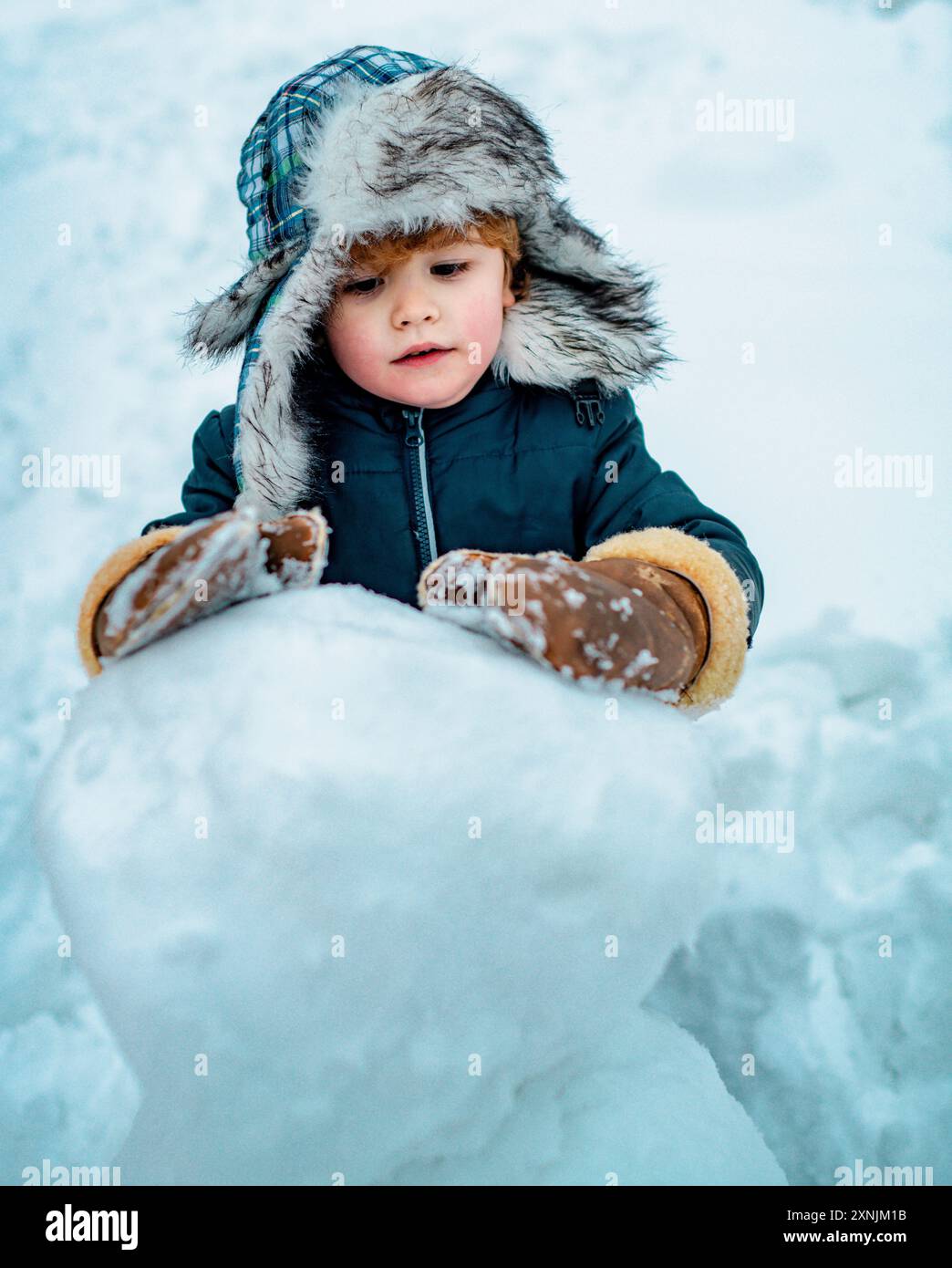 Kids having fun playing snowballs hi-res stock photography and images ...
