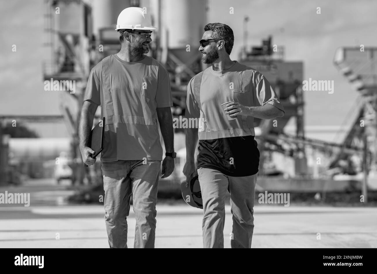 Two workers working team Black and White Stock Photos & Images - Alamy