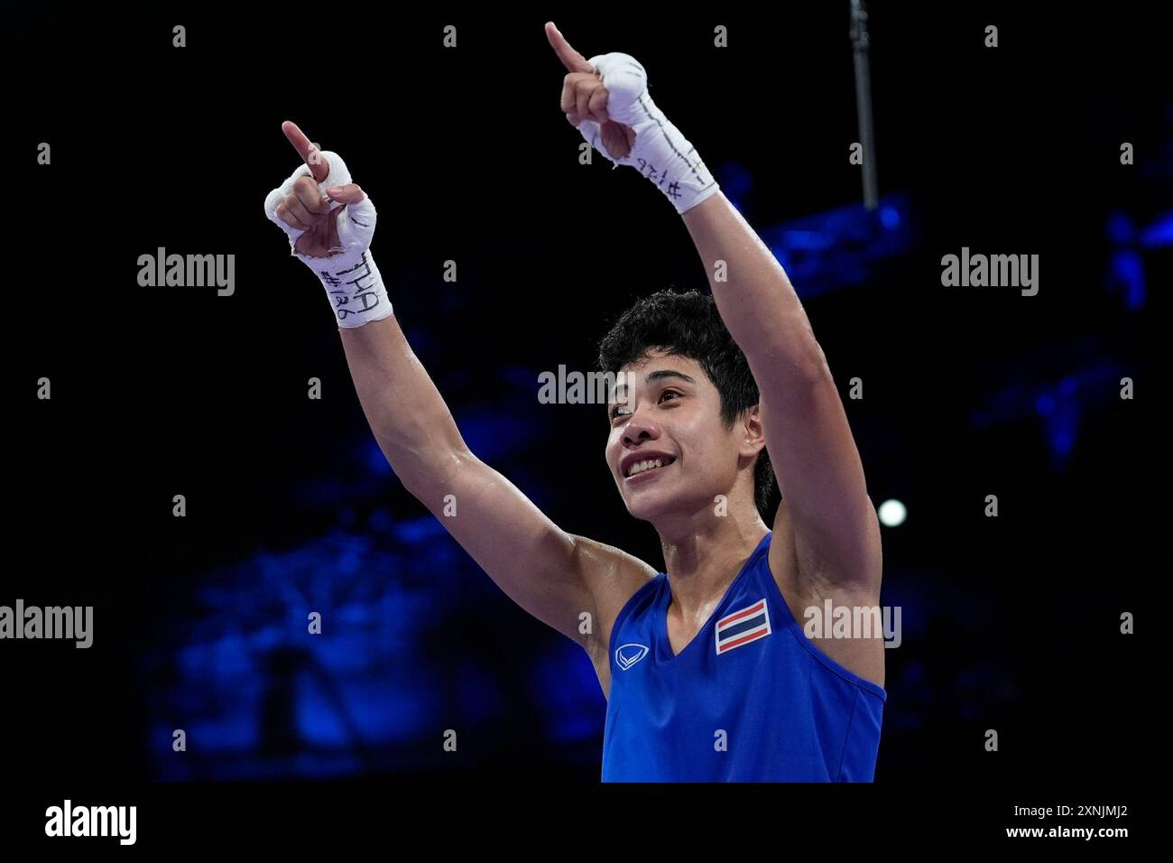 Thailand's Chuthamat Raksat, celebrates after defeating Uzbekistan's ...