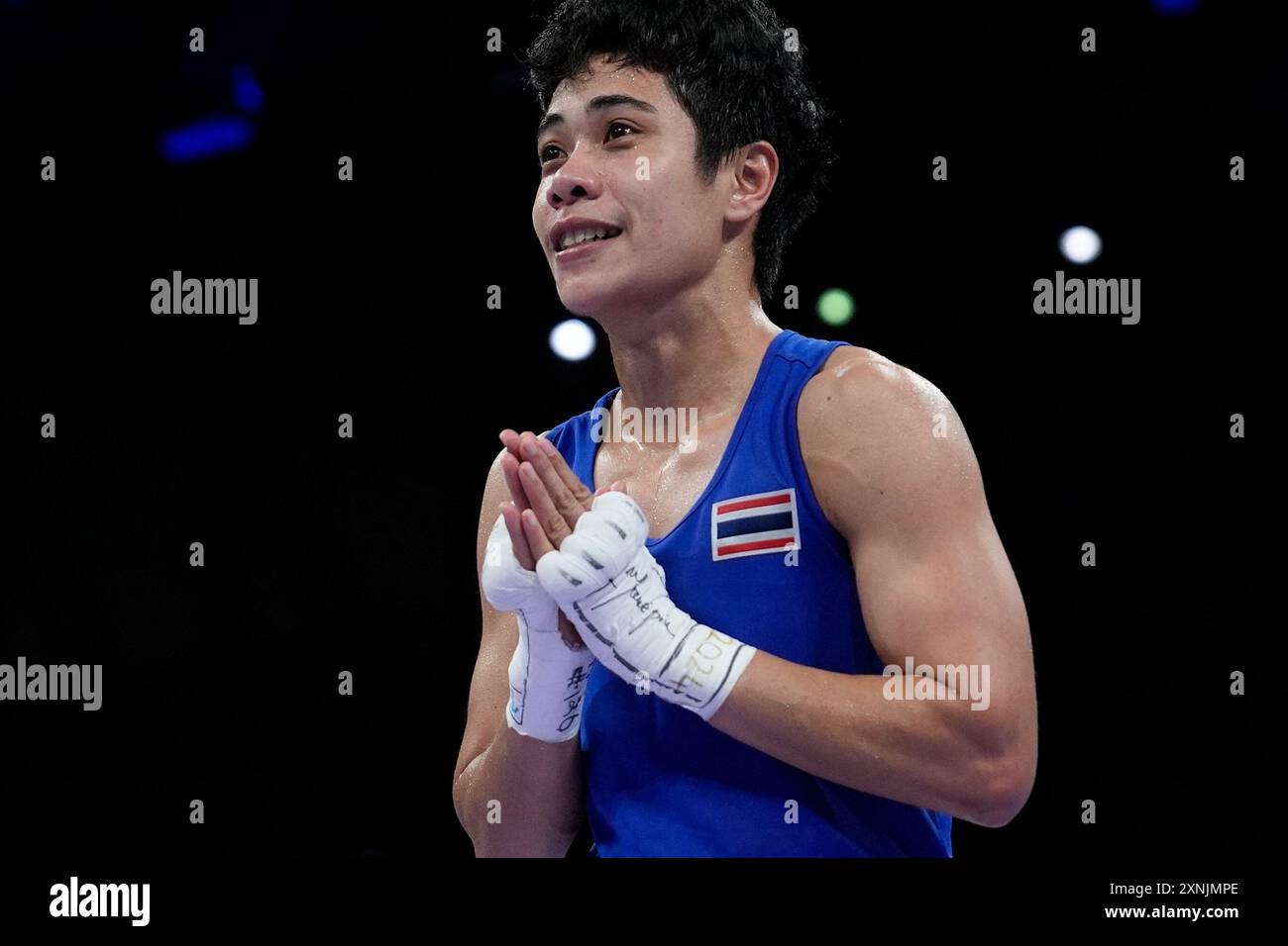 Thailand's Chuthamat Raksat, celebrates after defeating Uzbekistan's ...