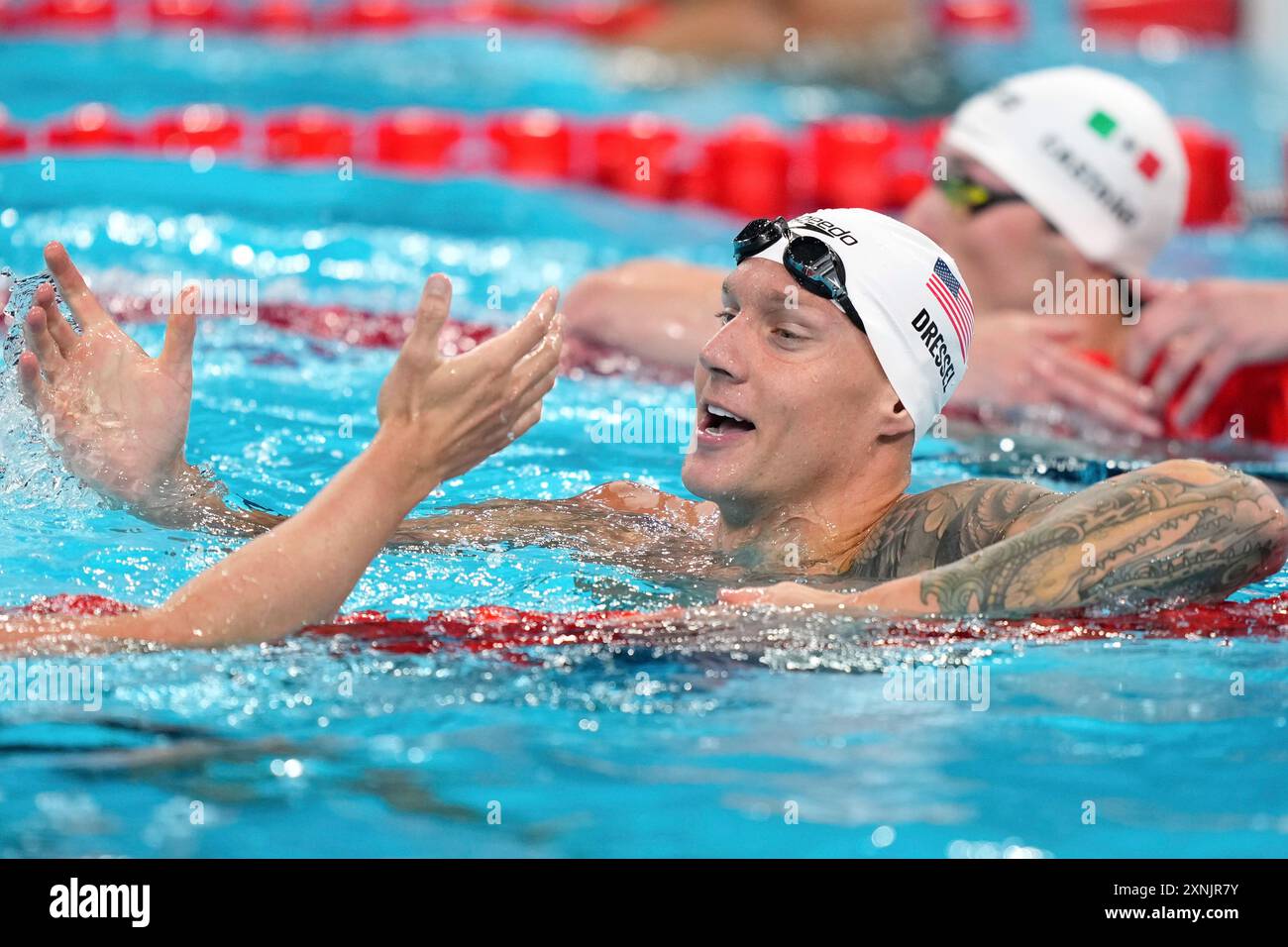 Caeleb Dressel, of United States, competes in their heat of the men's ...