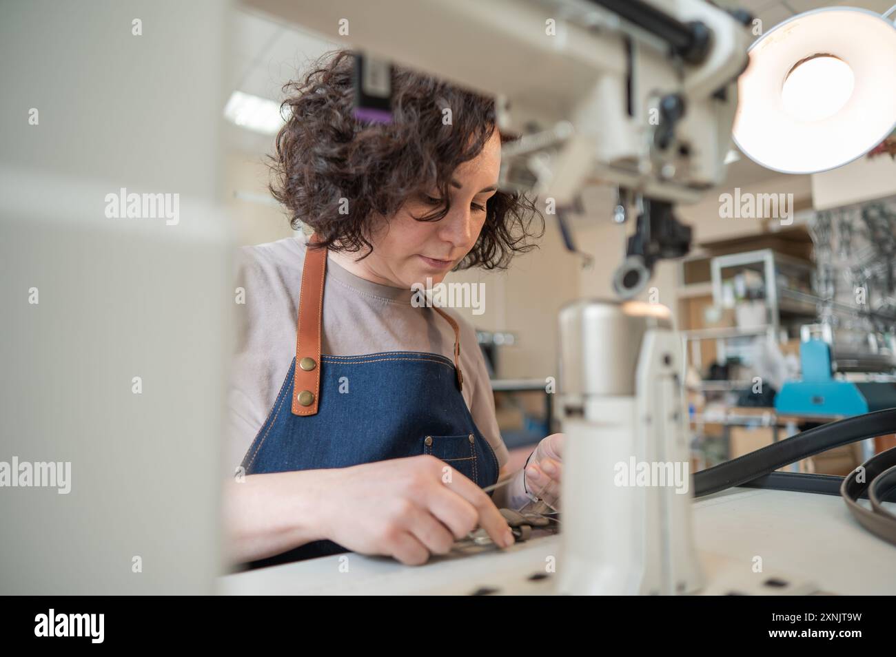 Woman tanner sews leather hi-res stock photography and images - Alamy