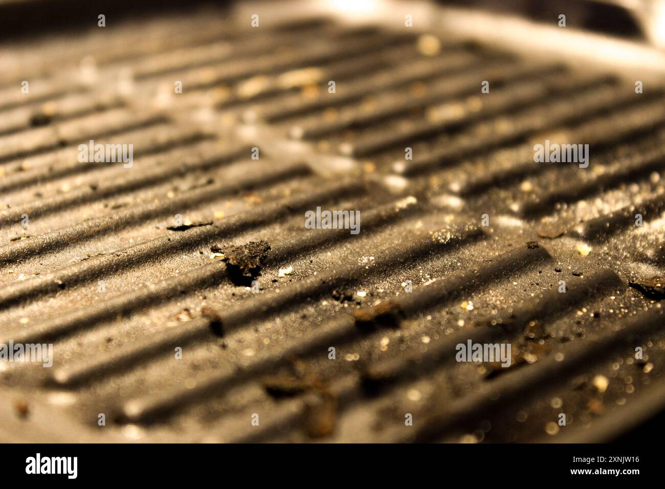 Bread crumbed dirty pan close up view Stock Photo - Alamy