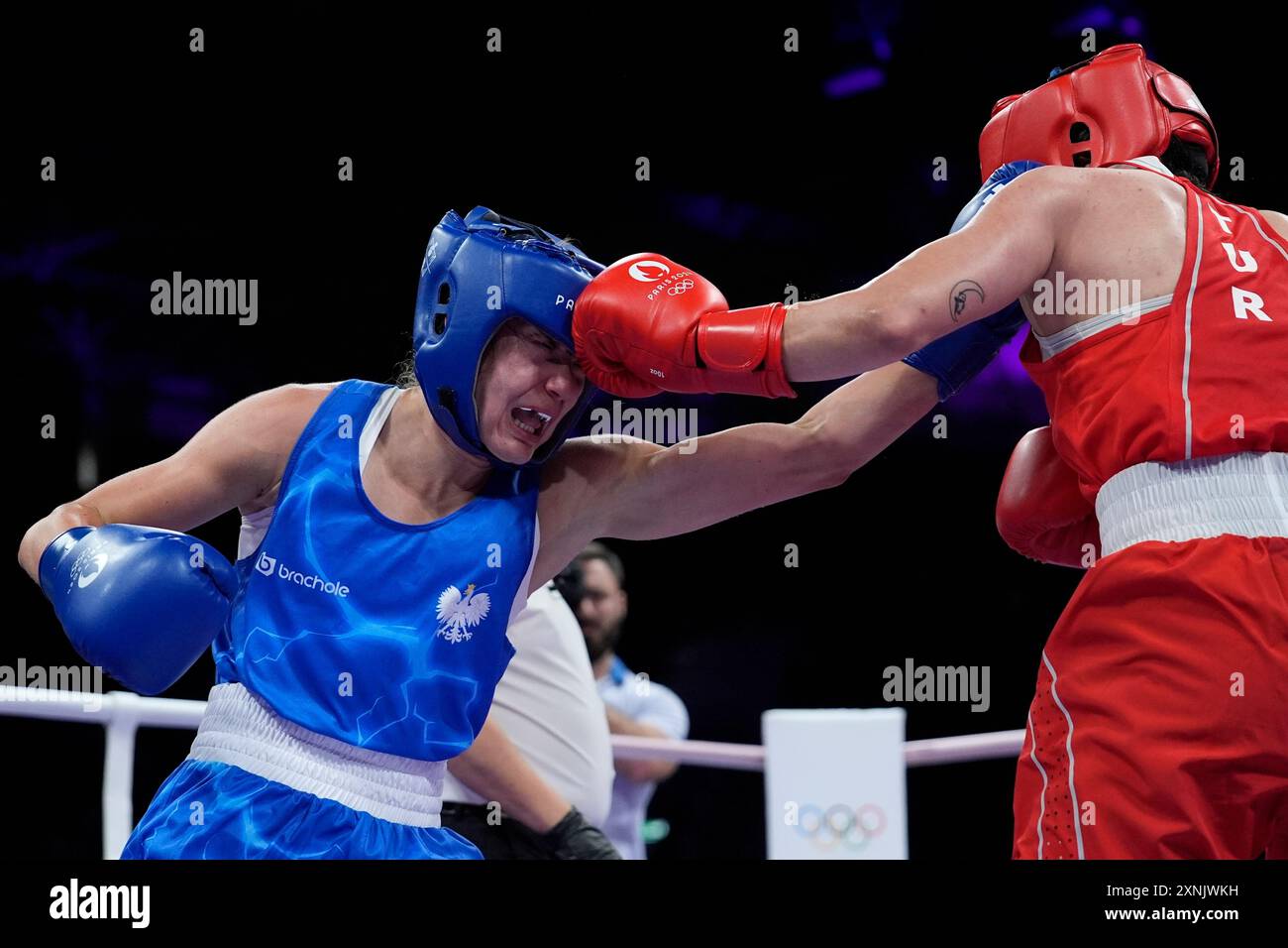 Turkey's Busenaz Surmeneli, right, fights Poland's Aneta Rygielska in ...