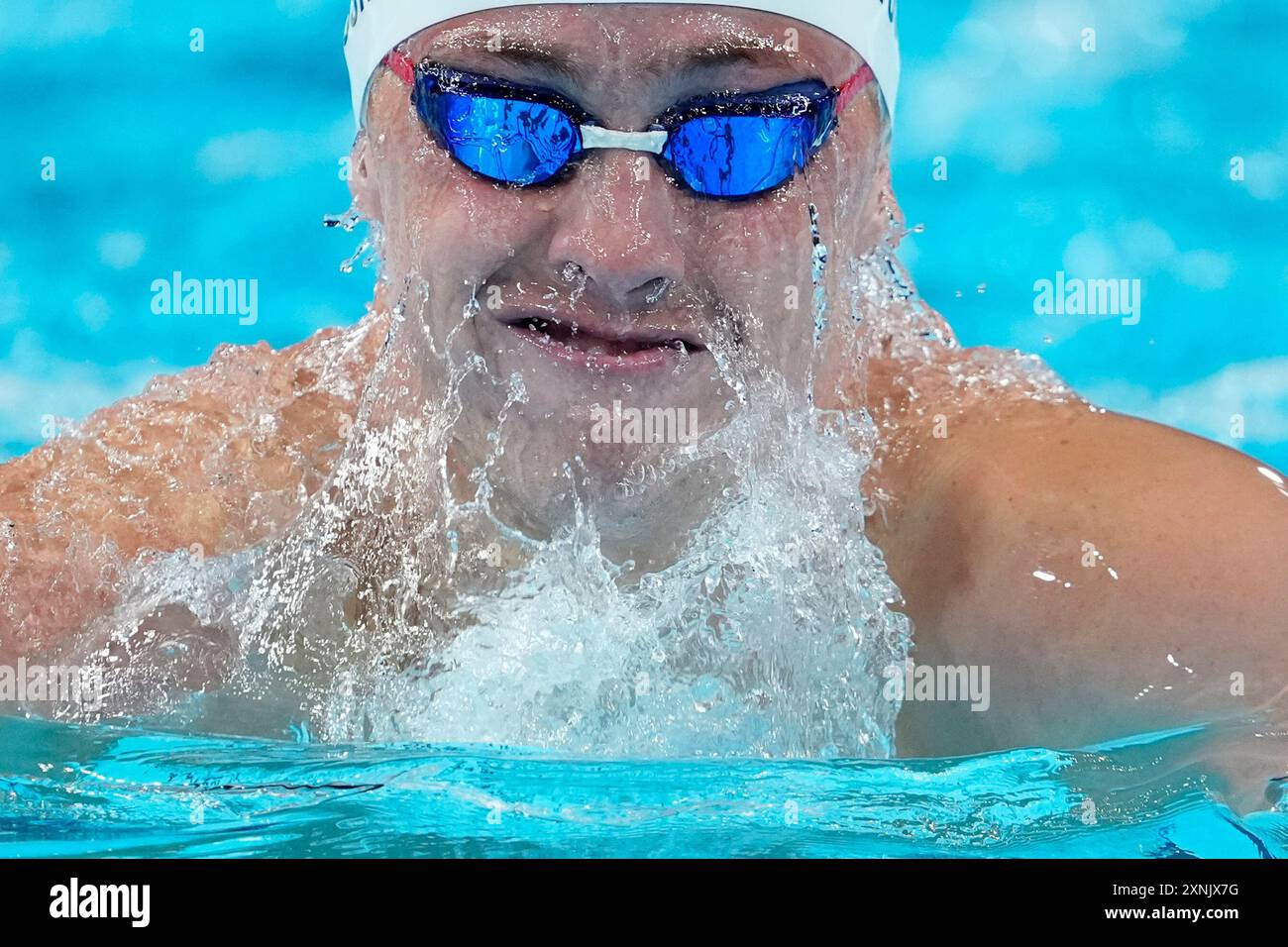 Carson Foster, of United States, competes in a heat of the men's 200 ...
