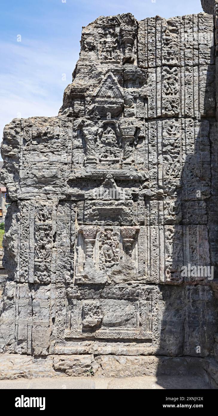 View of the ruined carvings of Hindu deities on the entrance gate of ...