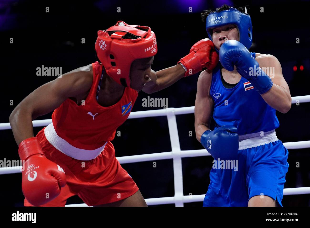 Democratic Republic of the Congo's Brigitte Mbabi, left, fights ...