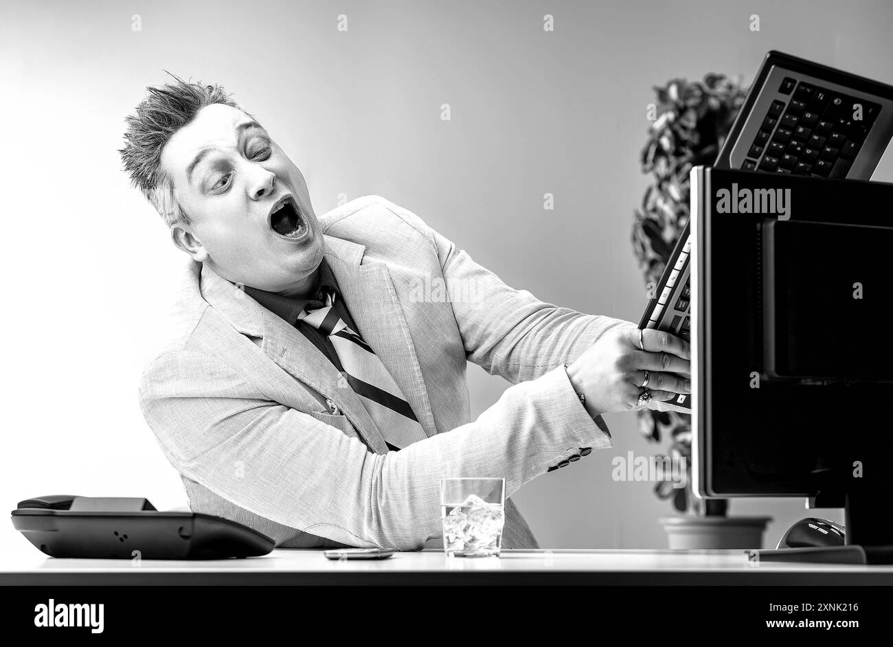 Black and white image of a furious businessman screaming at his ...