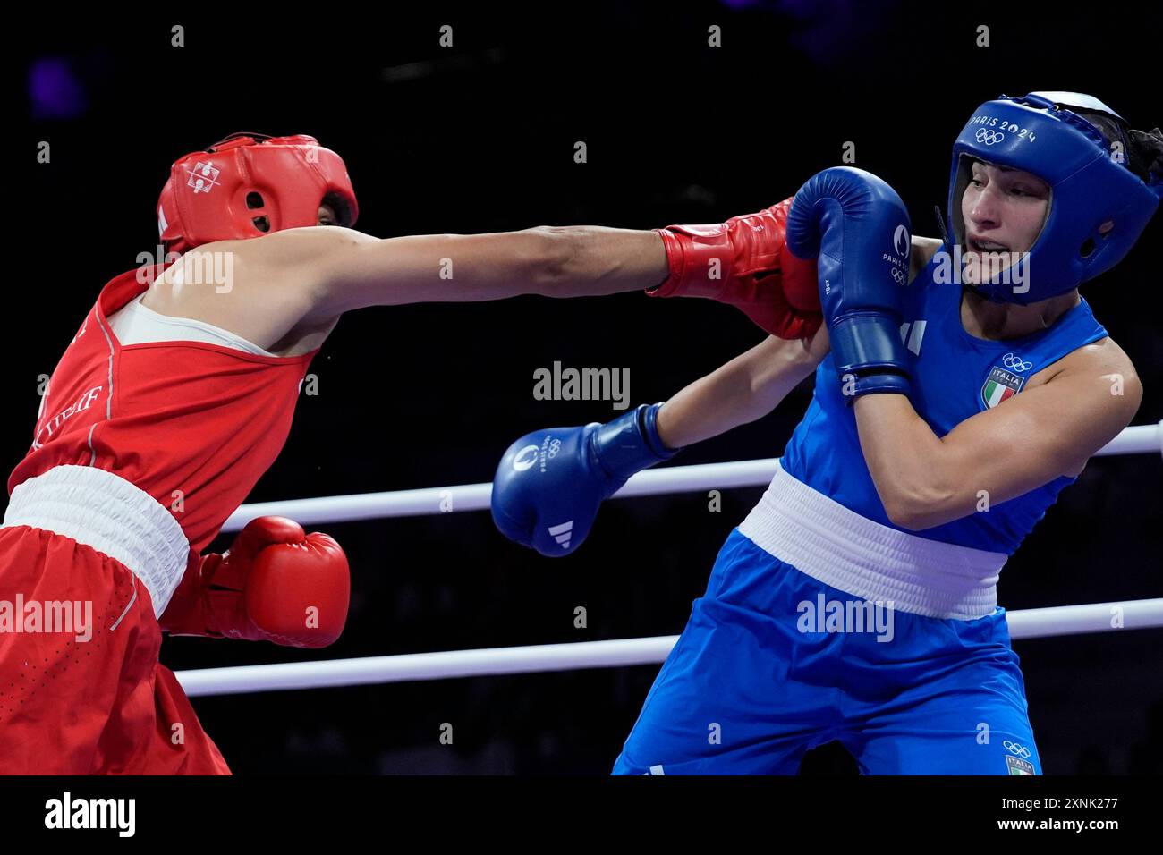 Algeria's Imane Khelif, left, fights Italy's Angela Carini in their ...