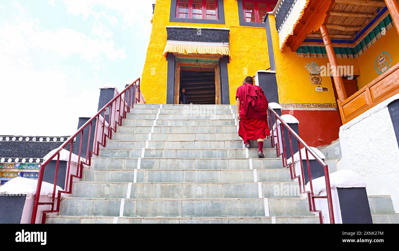 A Buddhist monk on the stair entrance of Thiksey Monastery, Thiksey ...