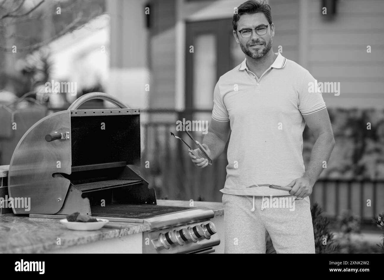 Grill chef cook. Guy with BBQ cooking tools. Barbecue and grill. Picnic ...